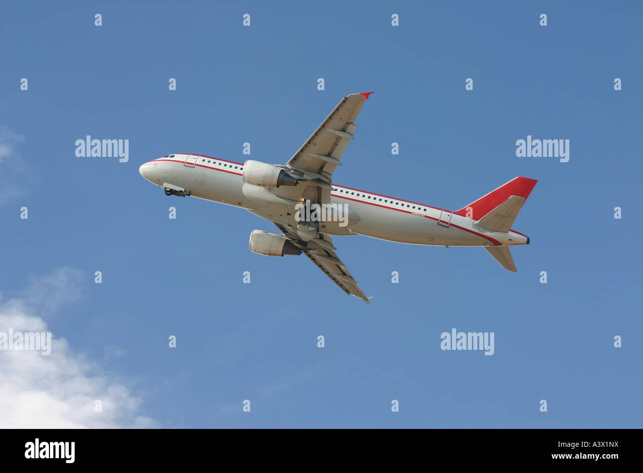 red and white commercial aircraft taking off Stock Photo - Alamy