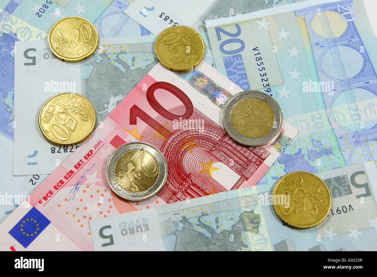 various euro notes and coins for background Stock Photo - Alamy