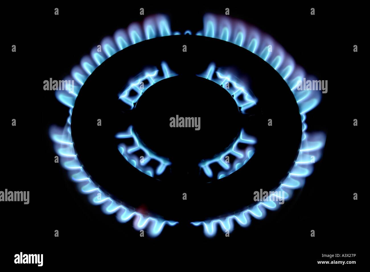 blue flames form a gas fire in a stove Stock Photo - Alamy