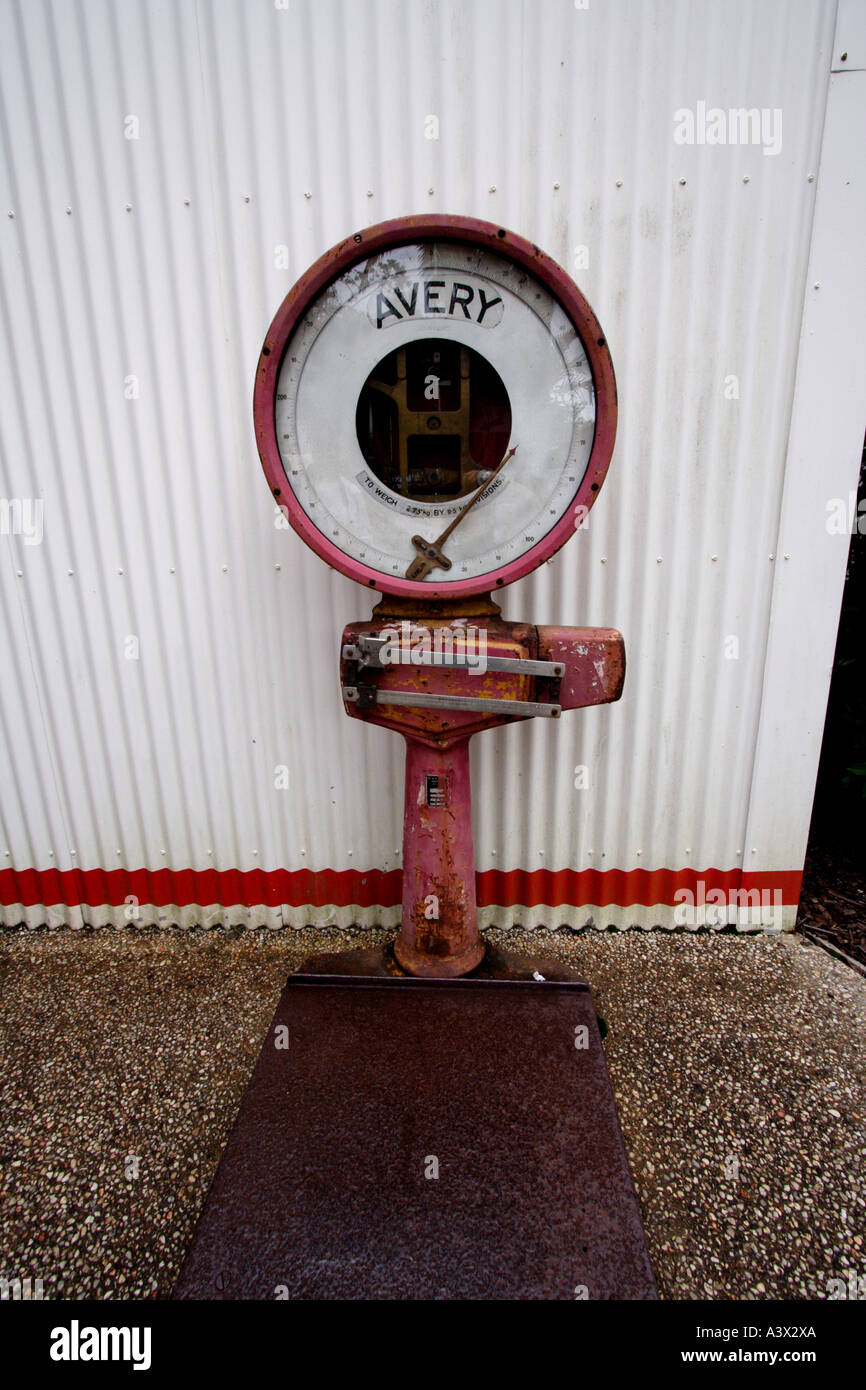 old fashioned weight scales against a white wall vertical Stock Photo ...