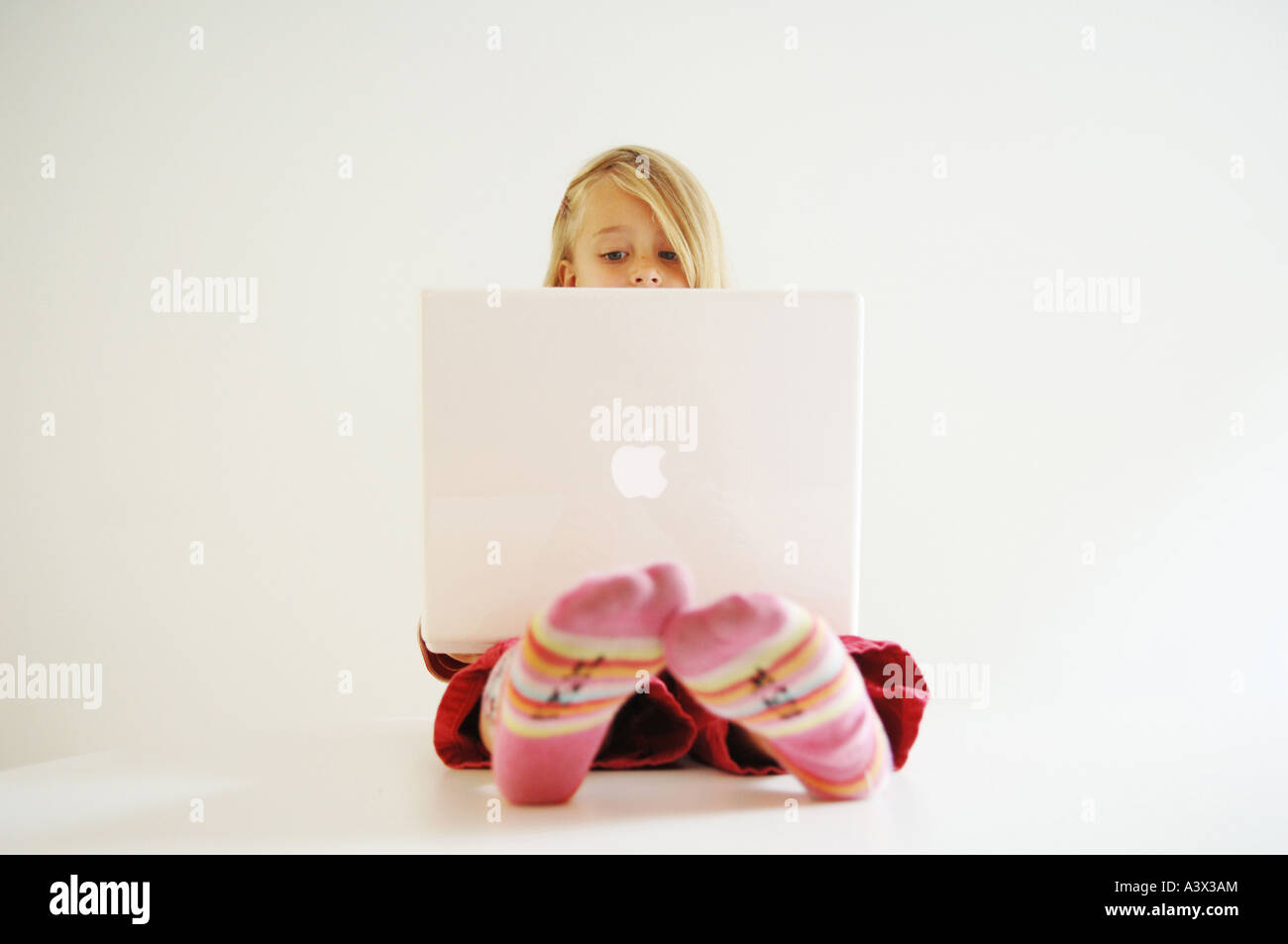 Four Year old girl with laptop computer Stock Photo - Alamy