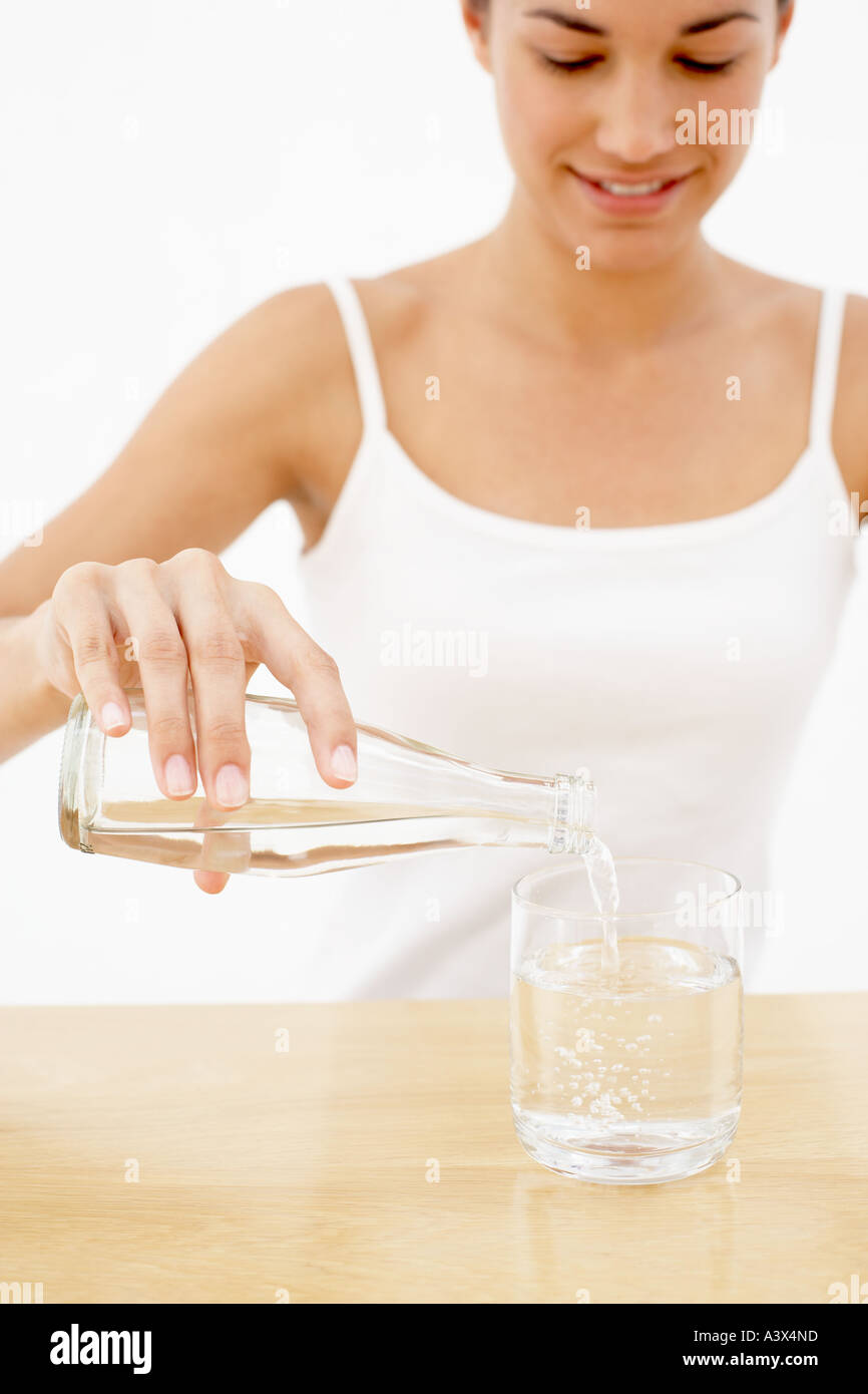 Hispanic woman pouring water hi-res stock photography and images - Alamy