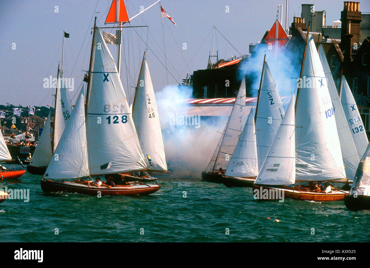 Cannon smoke from yacht race start signal Cowes Isle of Wight England ...