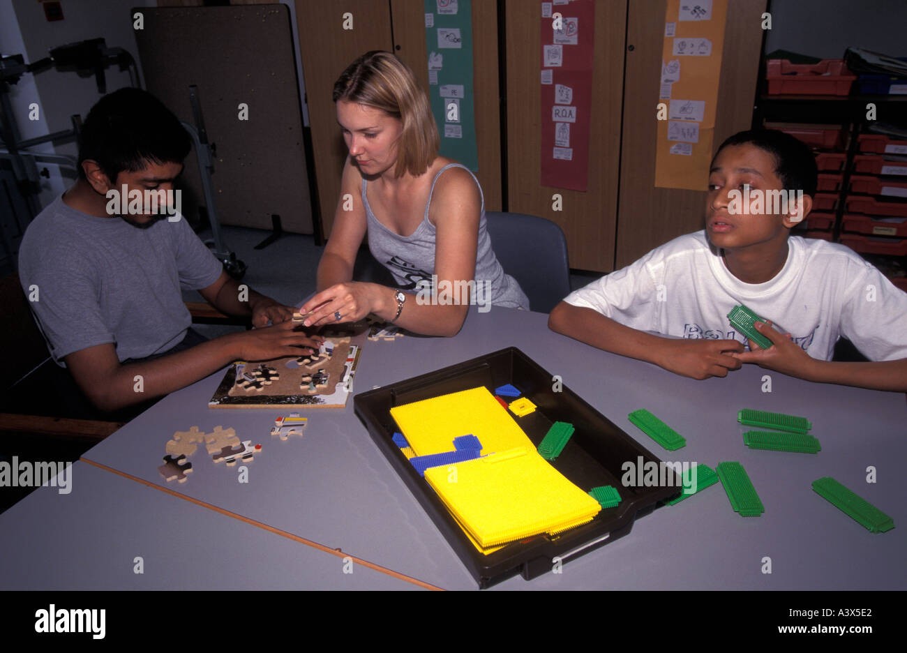 Children With Learning Difficulties Receiving Assistance From Female children-with-learning-difficulties-receiving-assistance-from-female
