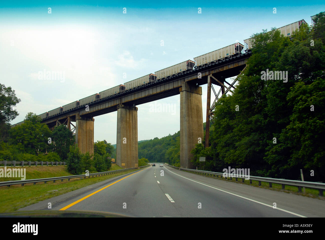 Train crossing bridge over highway hi-res stock photography and images ...