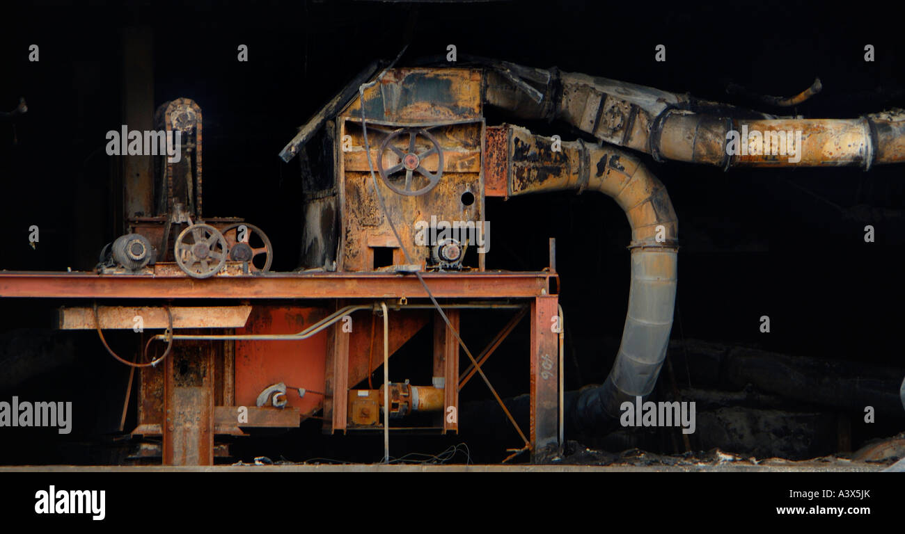 Old broken down machinery from a burnt out factory Stock Photo - Alamy