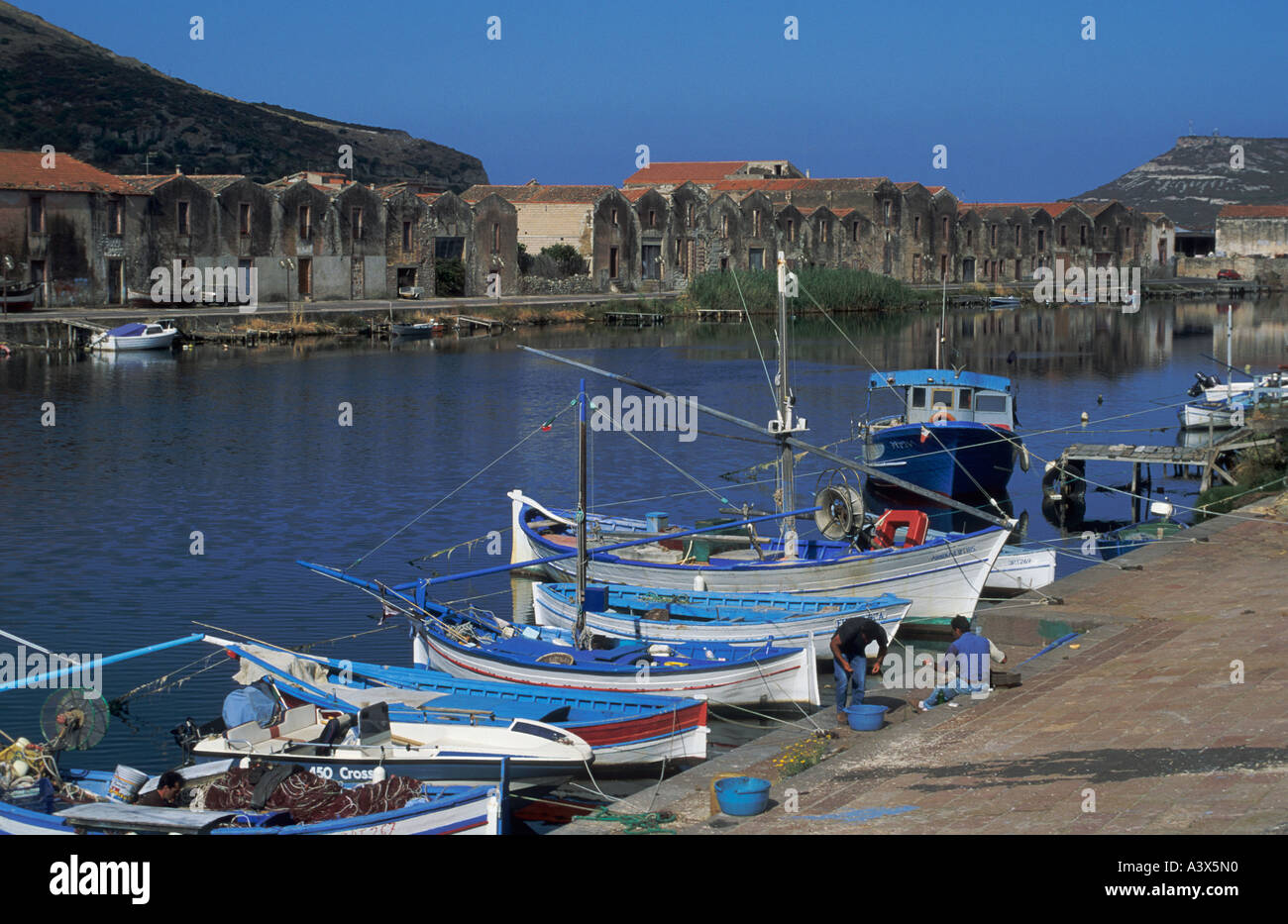 fishing boats a old buildings of a fish factory at th banks of th Temo ...