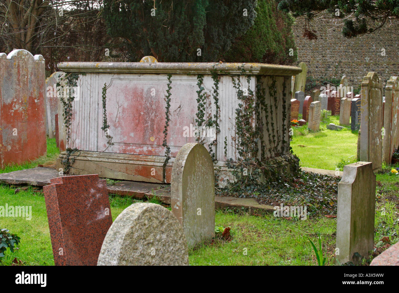 Ivy clad table tomb in Sussex, England Stock Photo - Alamy