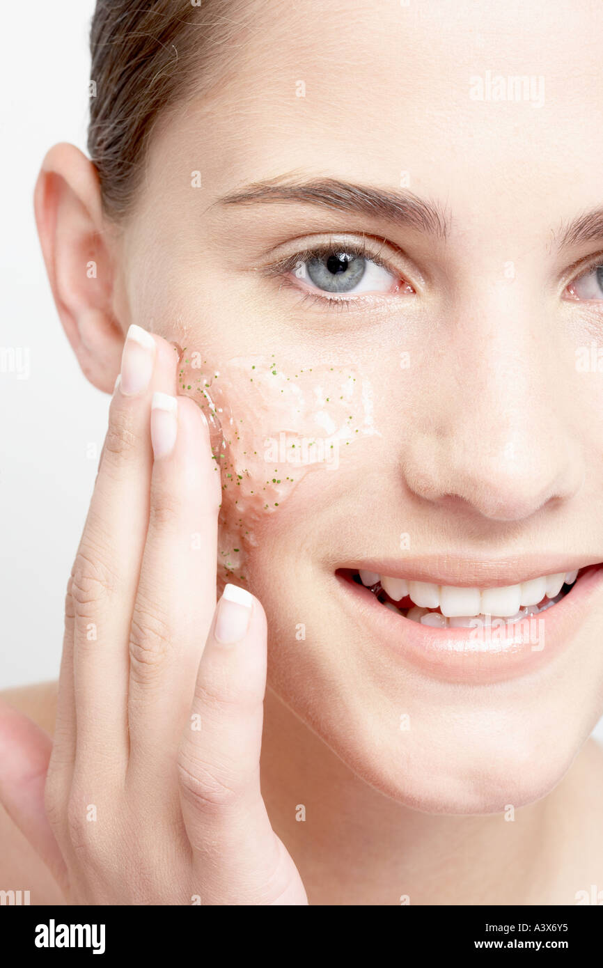 One woman apply face scrub hi-res stock photography and images - Alamy