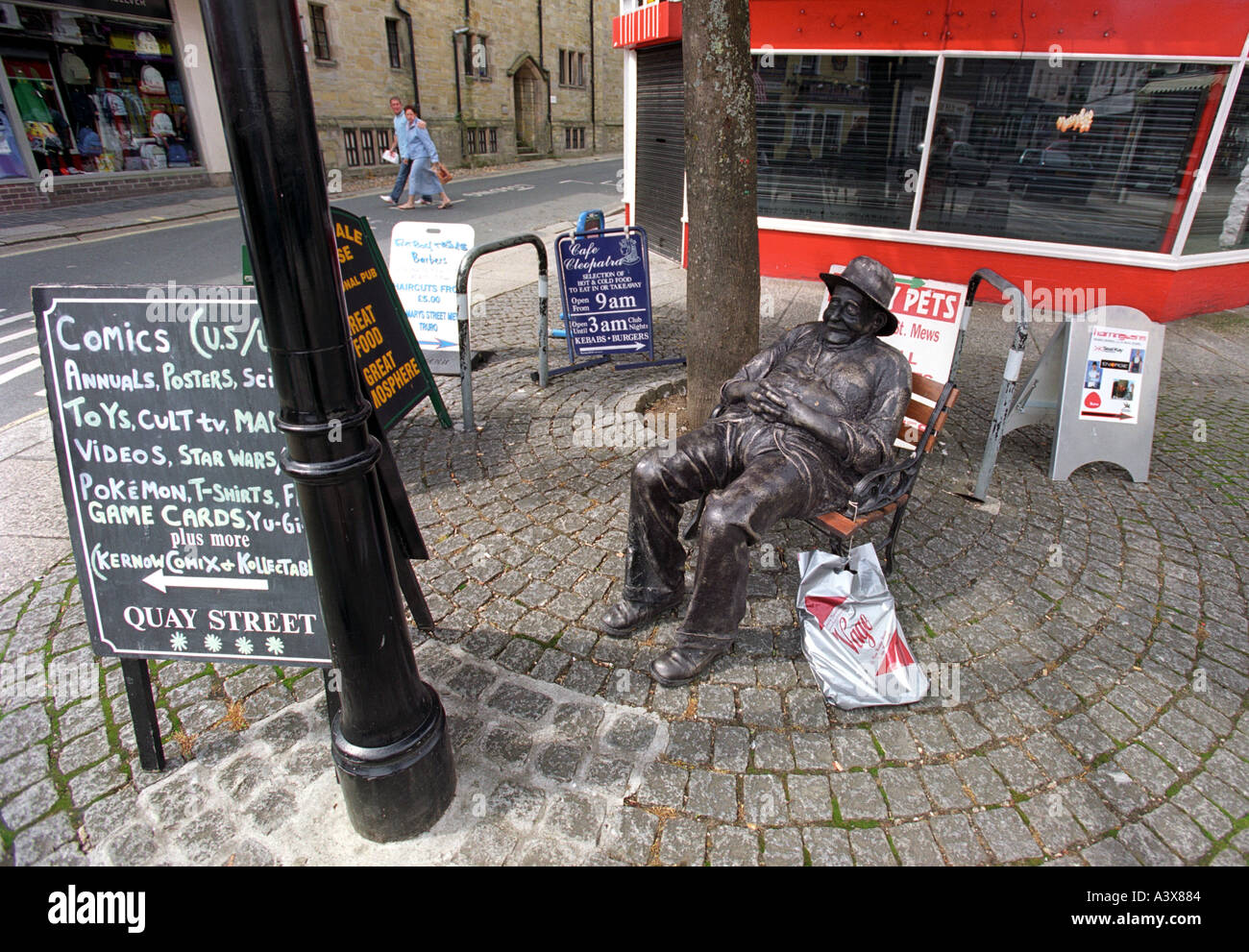 An amusing statue of a man sitting tired through shopping in Truro city ...