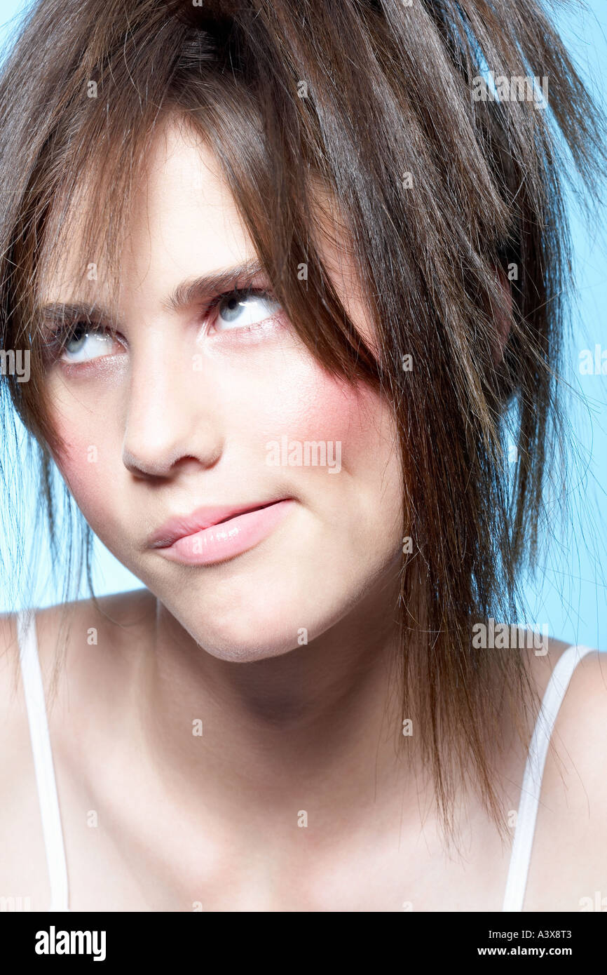 Young woman looking angry Stock Photo - Alamy