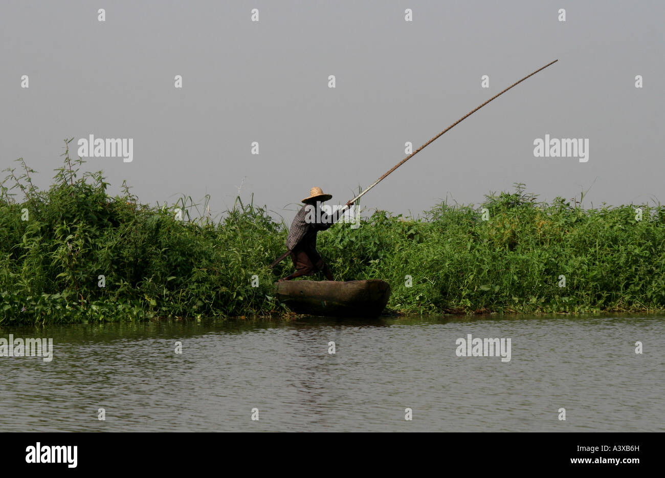 Man in Pirogue , Aguegue stilt village , Benin Stock Photo - Alamy