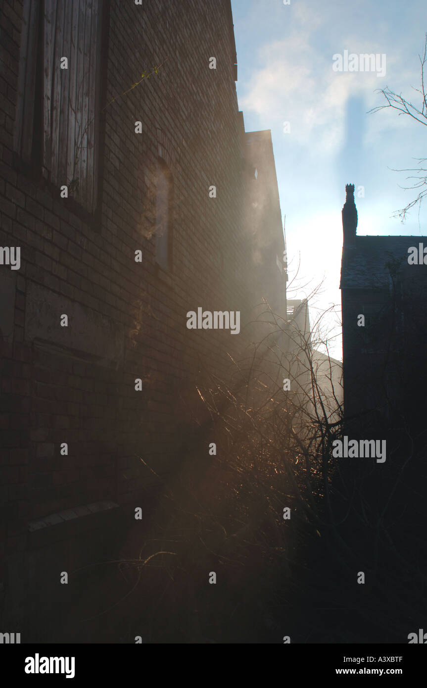 Smoke Escaping From A Burning Building Stock Photo - Alamy