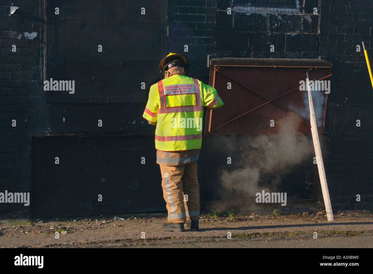 Smoke Escaping From A Burning Building Stock Photo - Alamy