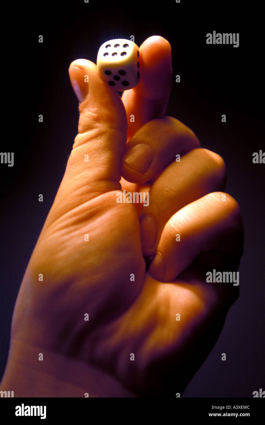 hand holding dice Stock Photo - Alamy