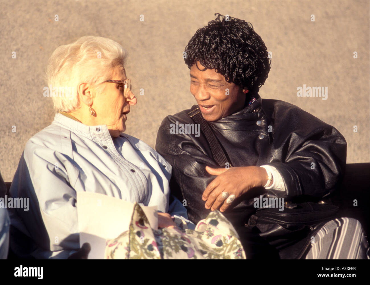 Old Friends Women Neighbors for decades talk on outside bench London UK ...