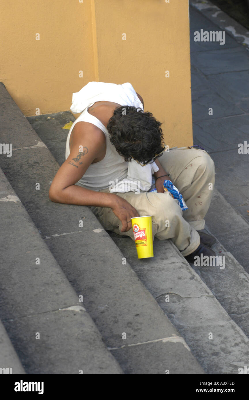 Sleeping beggar on steps of Catholic Church in Miami Florida USA ...