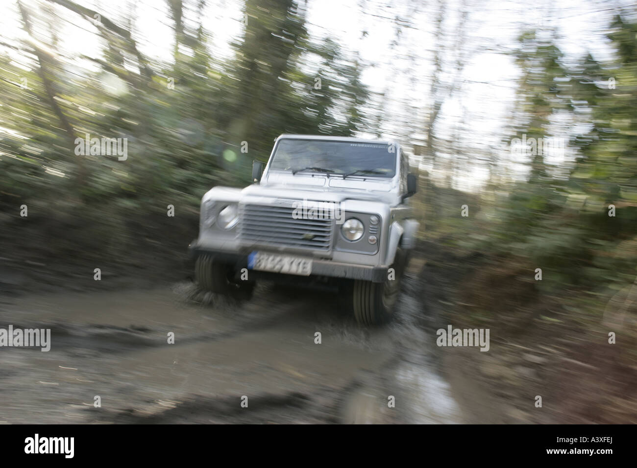 Land Rover Defender on an off-road course at the Land Rover factory in ...