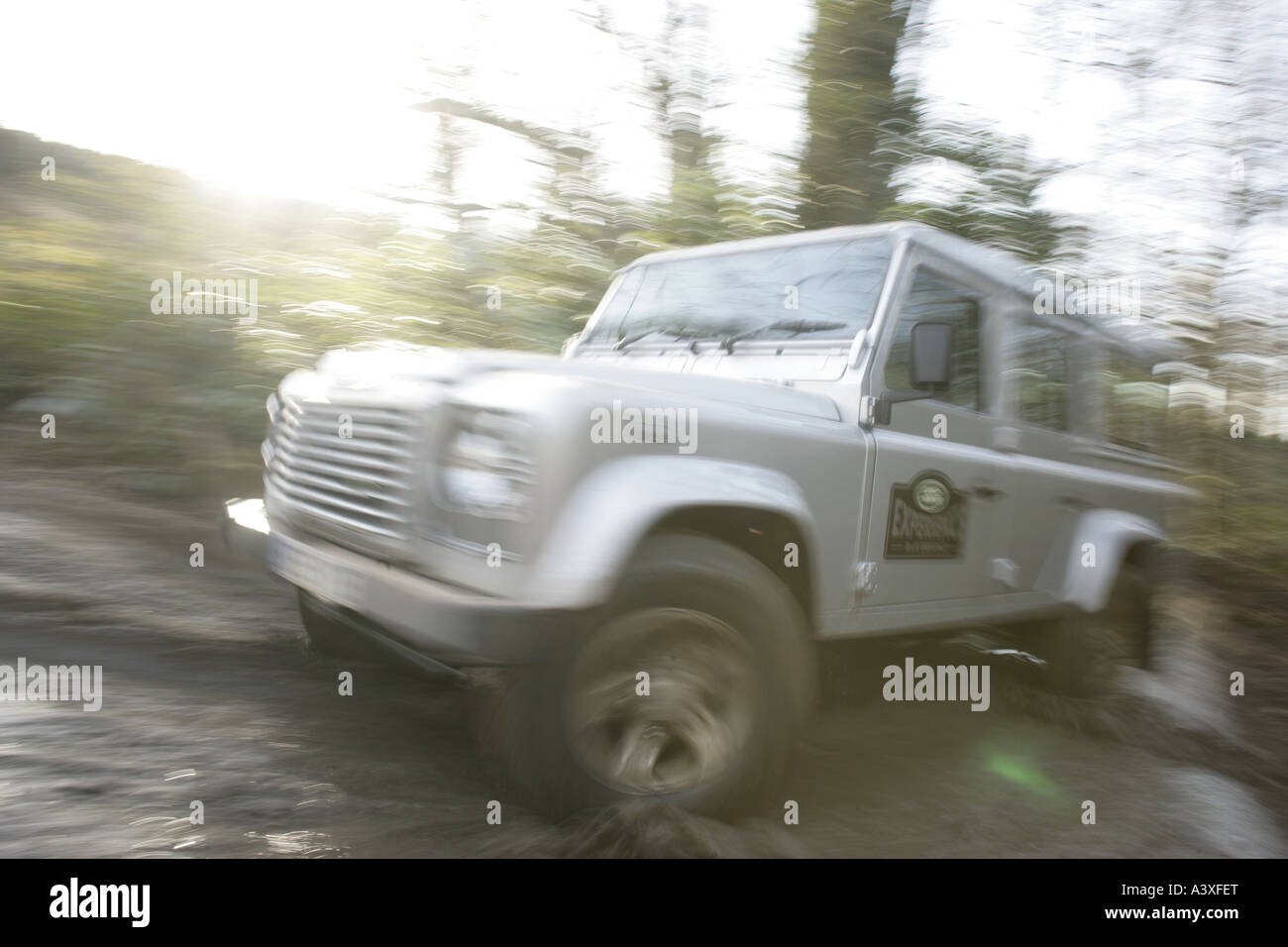 Land Rover Defender on an off-road course at the Land Rover factory in ...