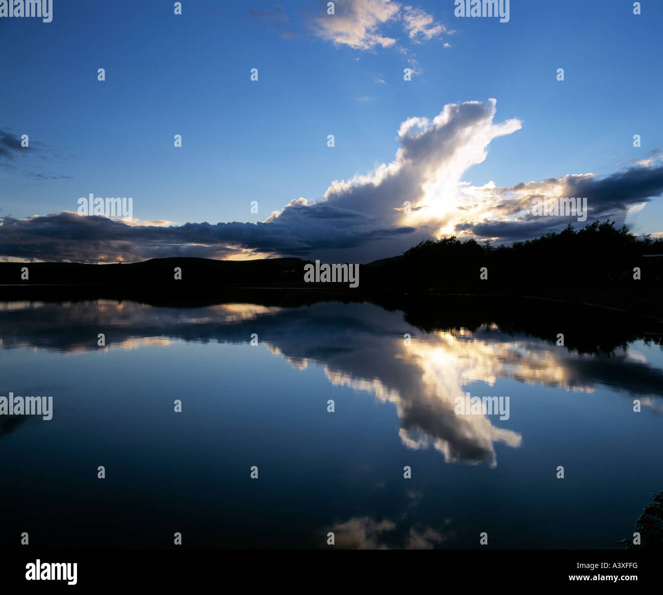dawn dusk sky reflected on calm waters of an irish inland lake Stock ...