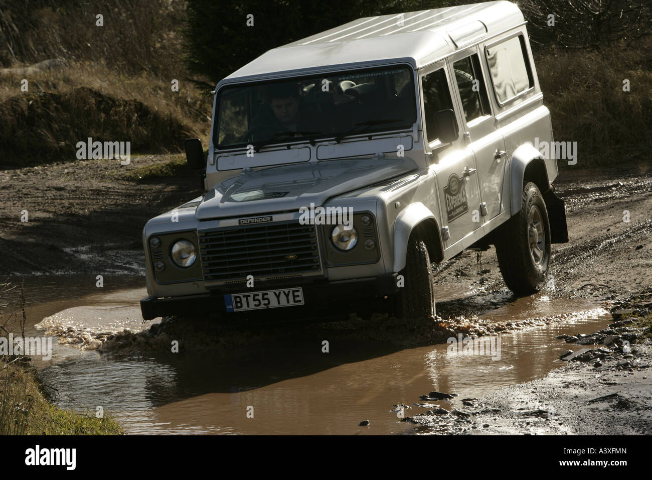 Land Rover Defender on an off-road course at the Land Rover factory in ...