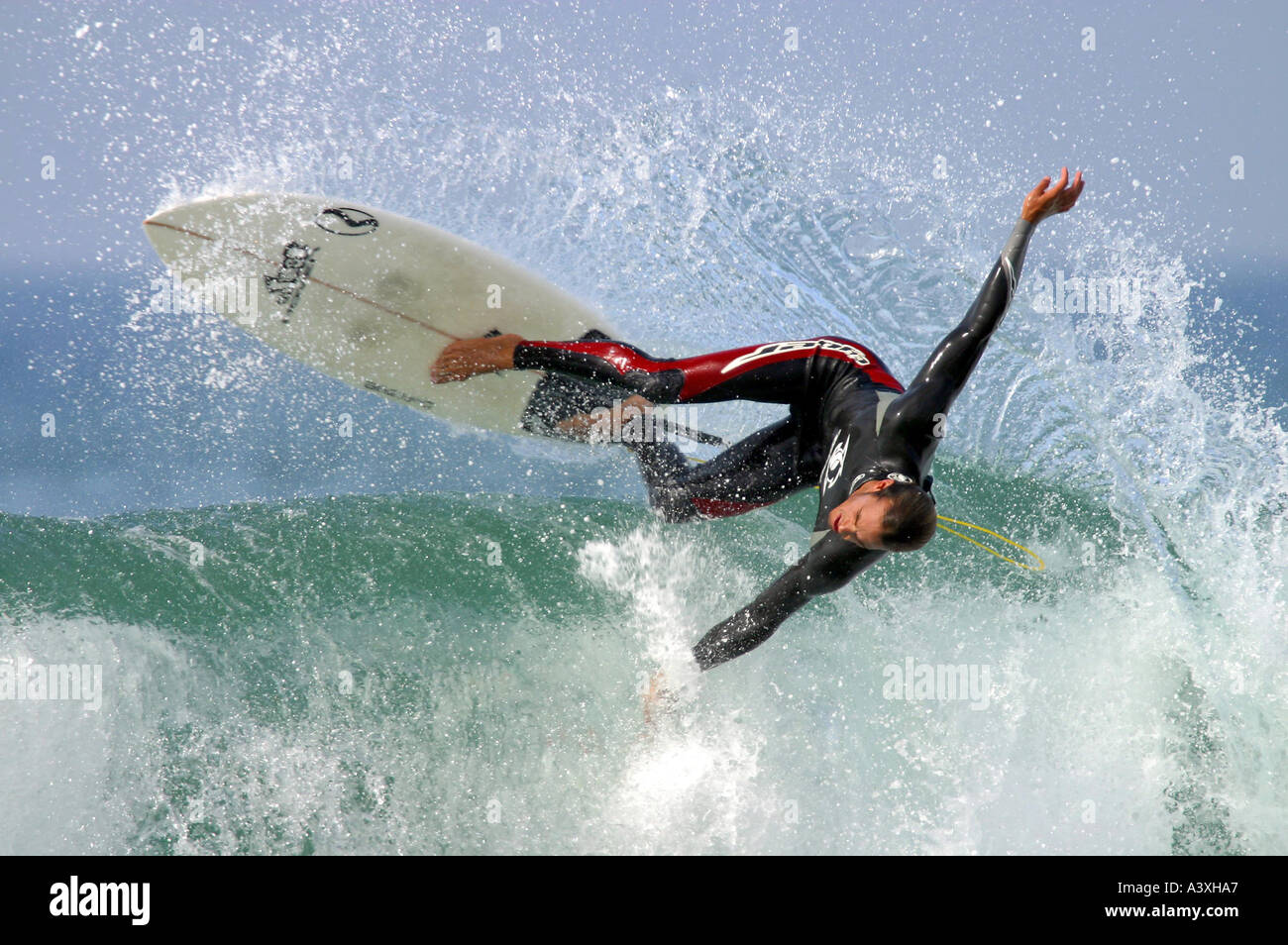 Surfer riding a Wave Stock Photo - Alamy