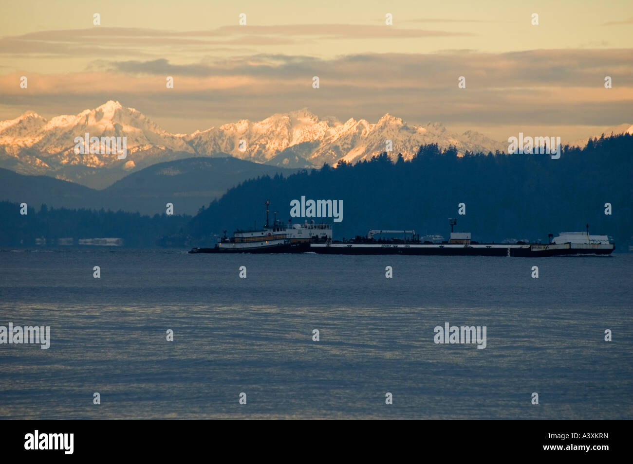 Olympic Mountains and Puget Sound, Washington, at sunrise, with tug ...