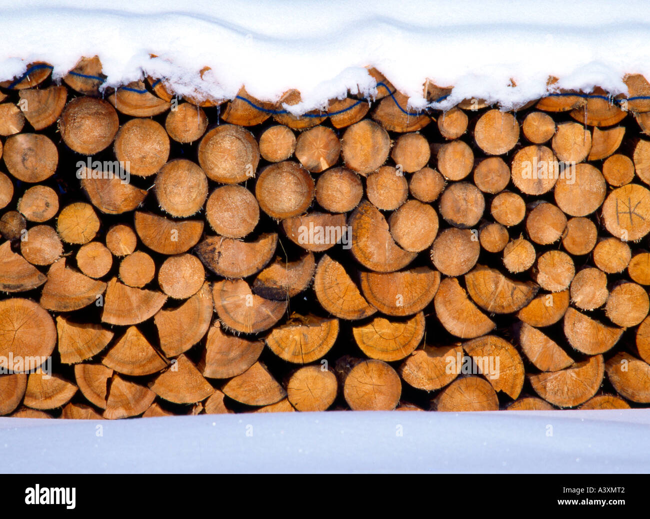 pile of wood covered with snow Stock Photo - Alamy