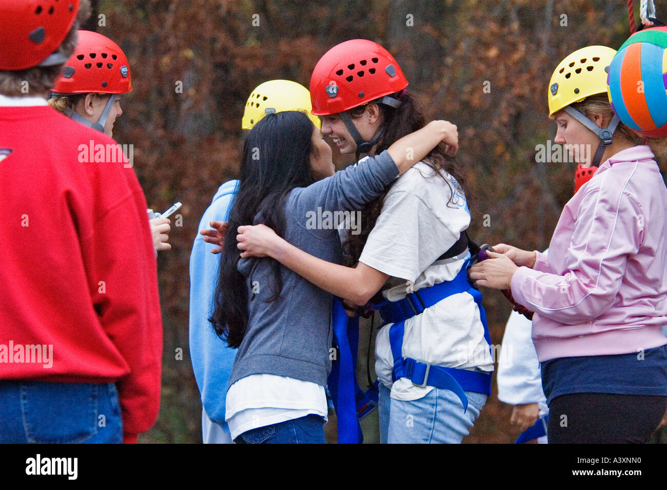 Teenage Girls Celebrating After Participating In Ropes Team Building ...
