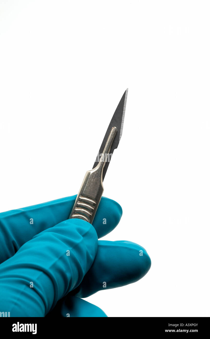 scalpel blade gloved hand, cosmetic Surgery Stock Photo - Alamy