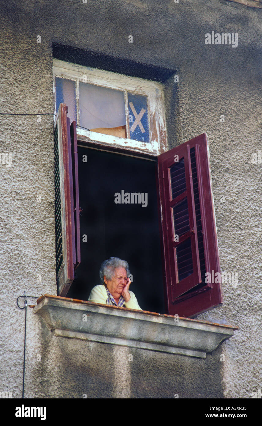 Woman looking out her window in Old Havana Cuba Stock Photo - Alamy