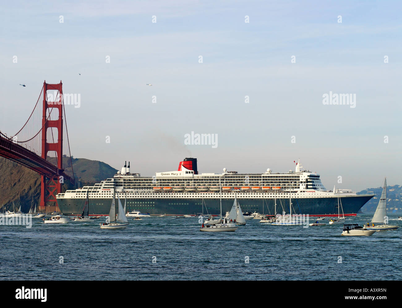 "^QM2, passing under "Golden Gate Bridge", greeted by flotilla of ...