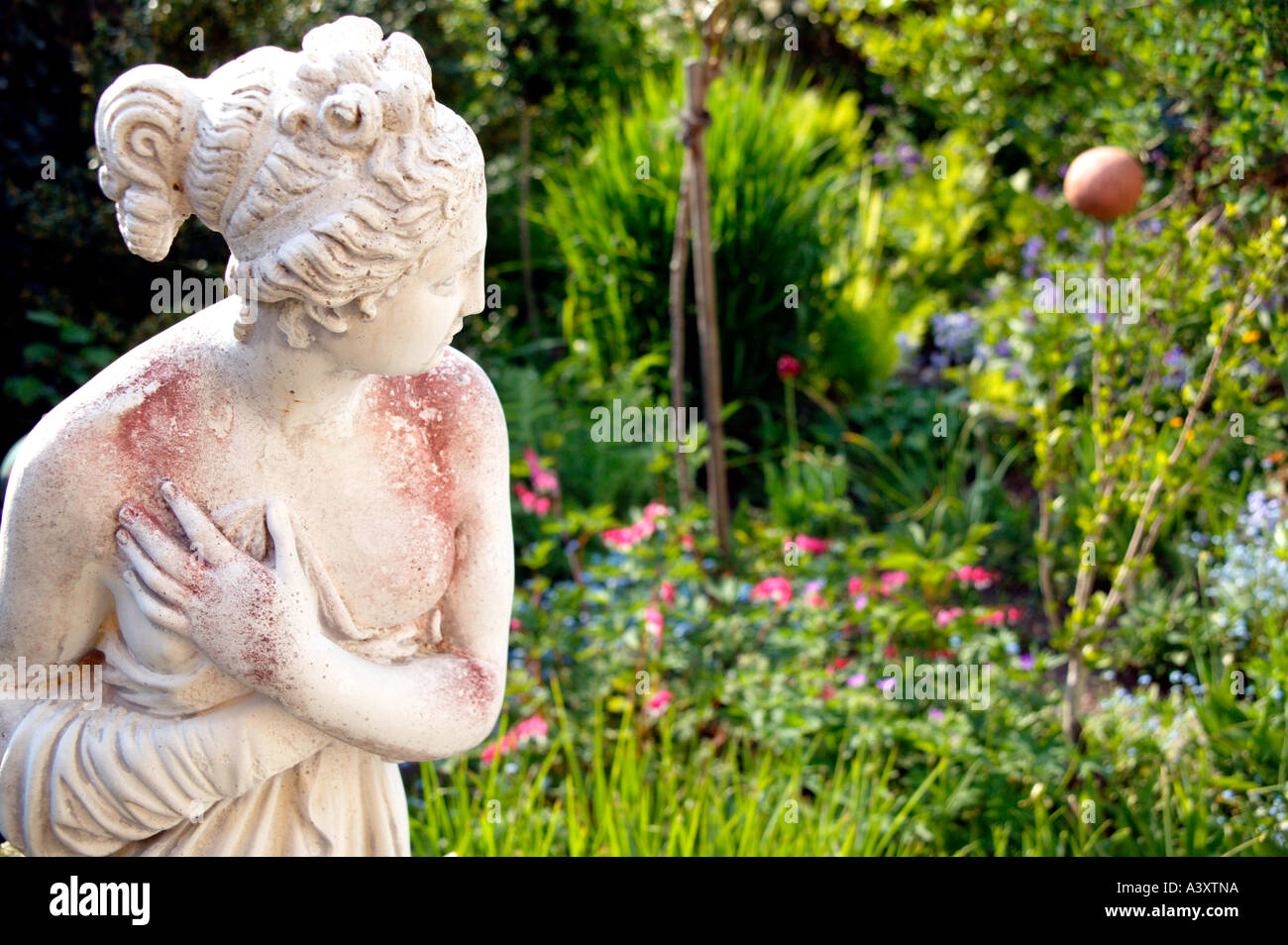 stone monument in garden Stock Photo - Alamy