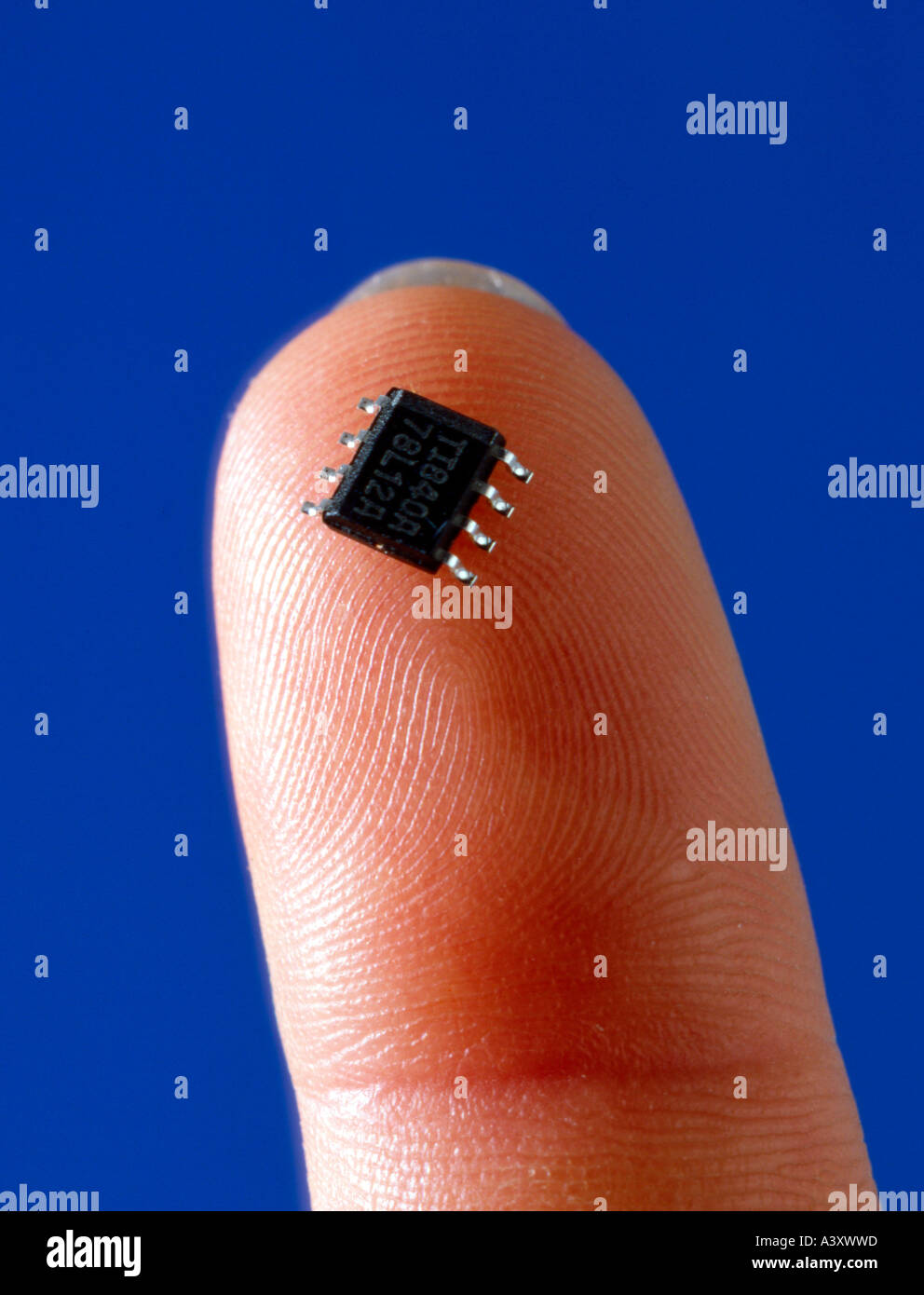 microchip on fingertip Stock Photo - Alamy