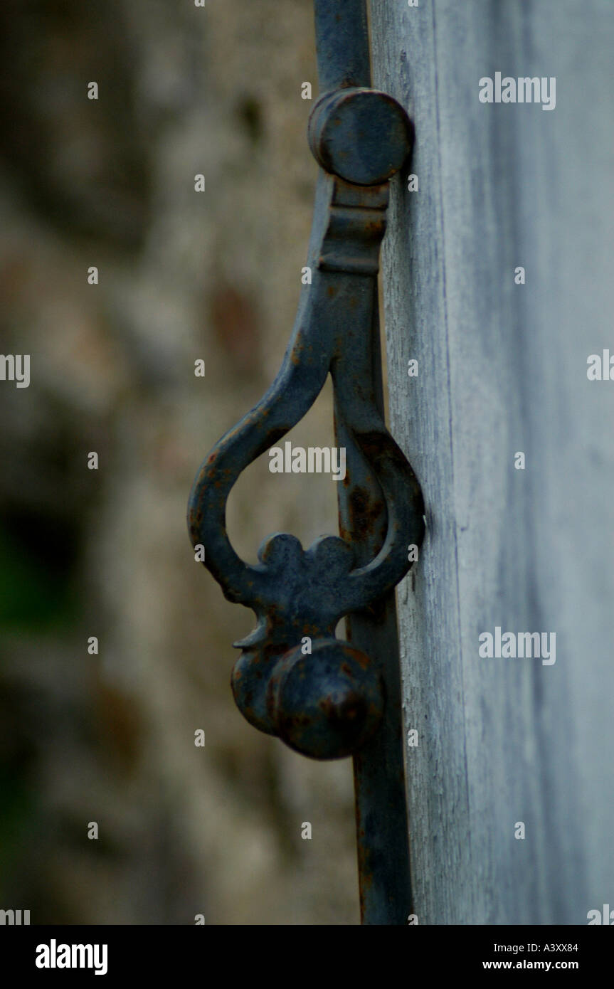 french window ornate handle for locking shutters at night Stock Photo ...
