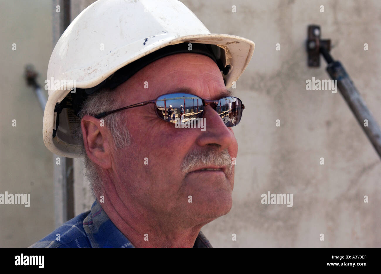 Old worker on building site Stock Photo - Alamy