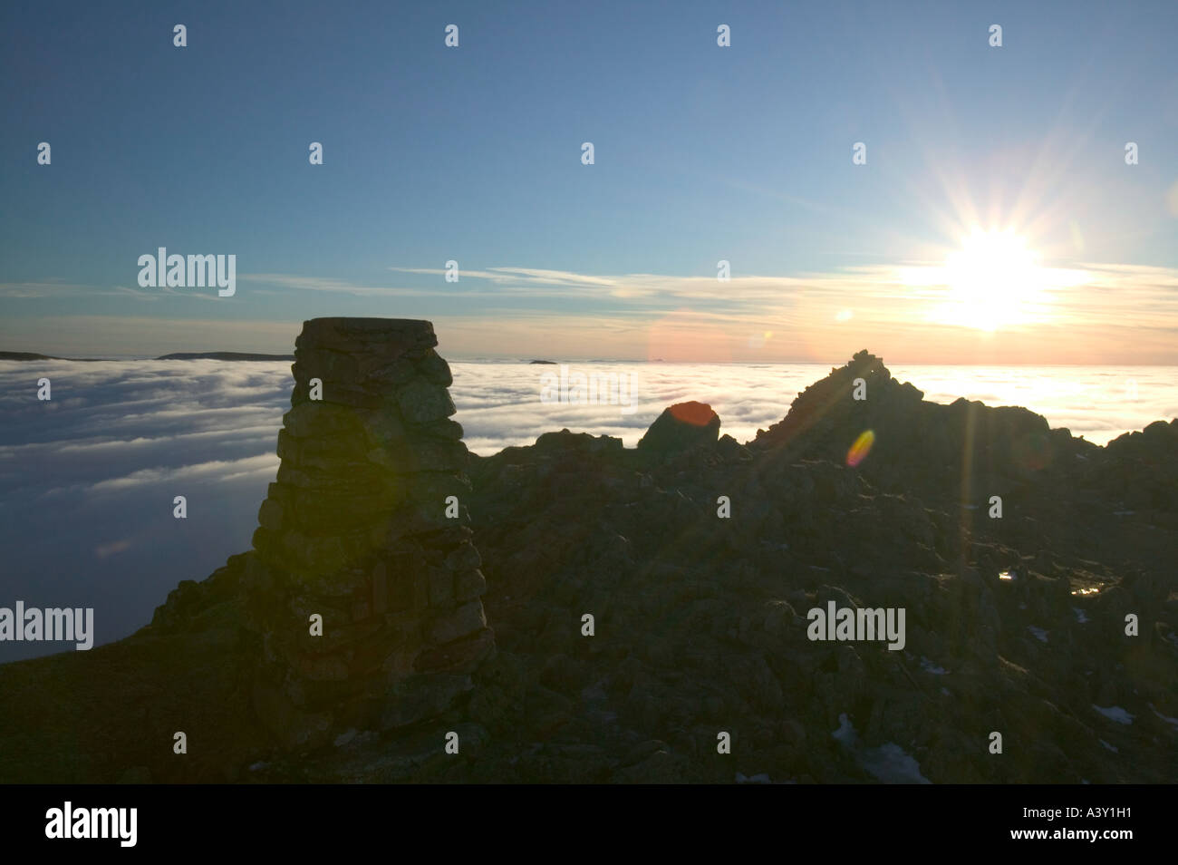 The summit of Red Screes rising above a cloud temperature inversion ...
