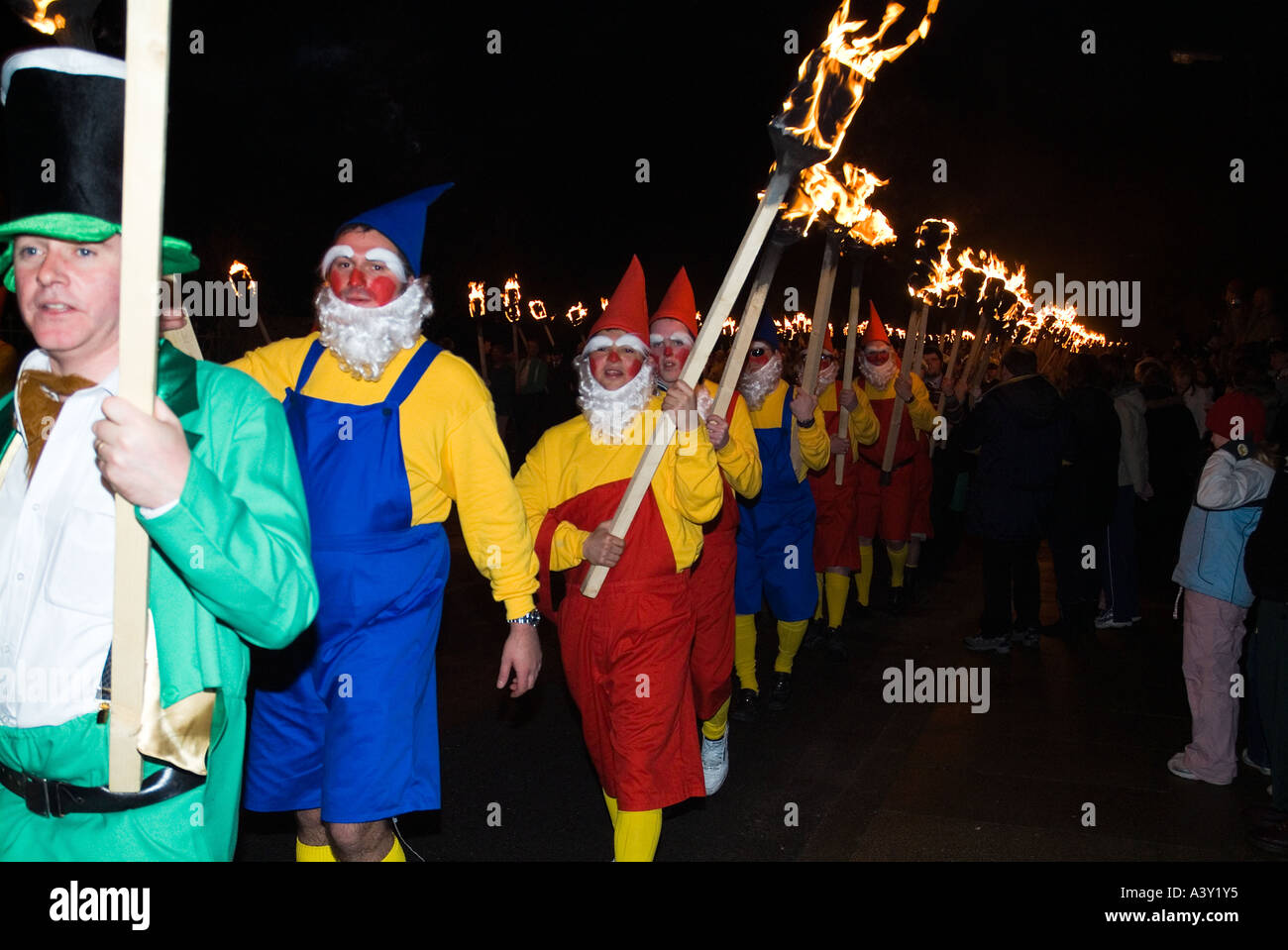 dh Up Helly Aa fire procession LERWICK SHETLAND Guizers with torches ...
