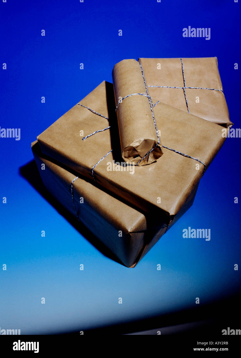 parcels wrapped in packing paper Stock Photo - Alamy