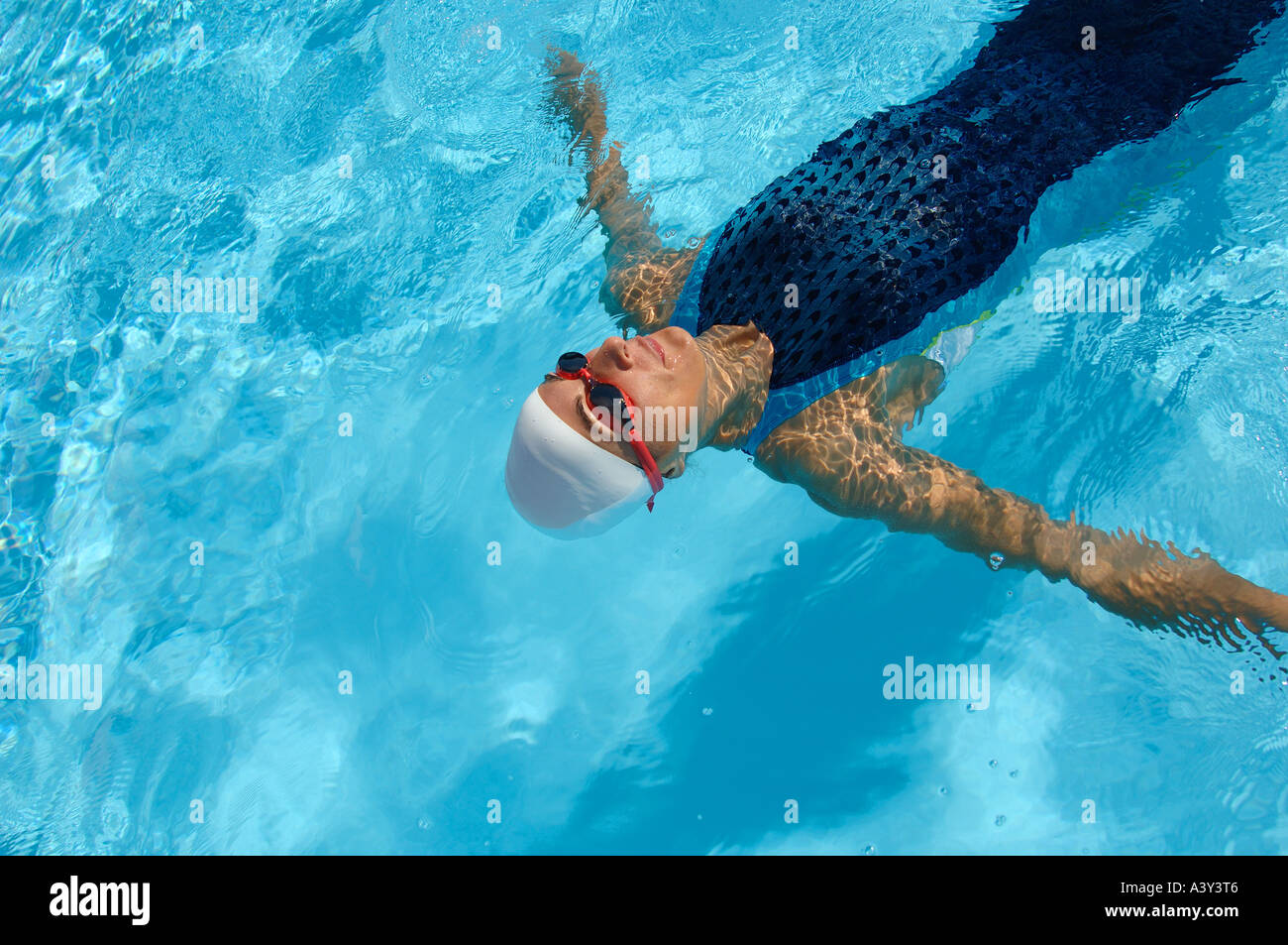 View of Female Swimmer Swimming Backstroke Stock Photo - Alamy