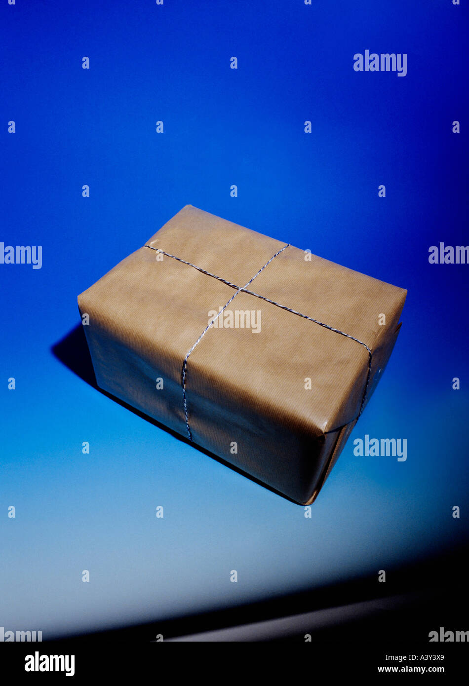 parcel wrapped in packing paper Stock Photo - Alamy