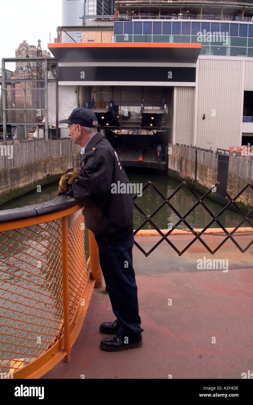 Male ferry worker leaning front boat railing New York City port Stock ...
