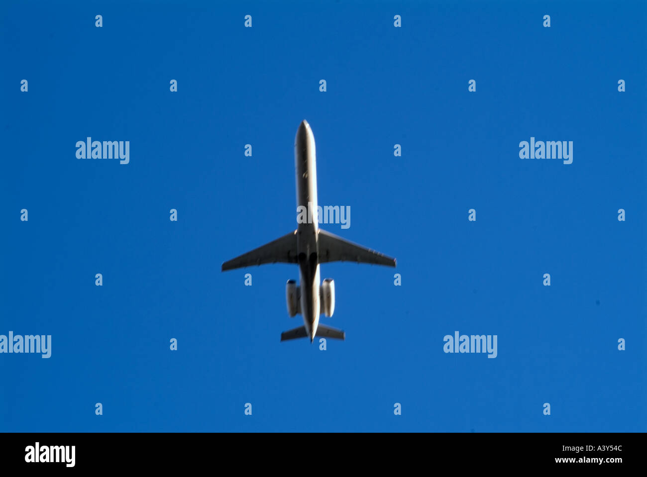 Underneath jet plane flying upward overhead during takeoff Stock Photo ...