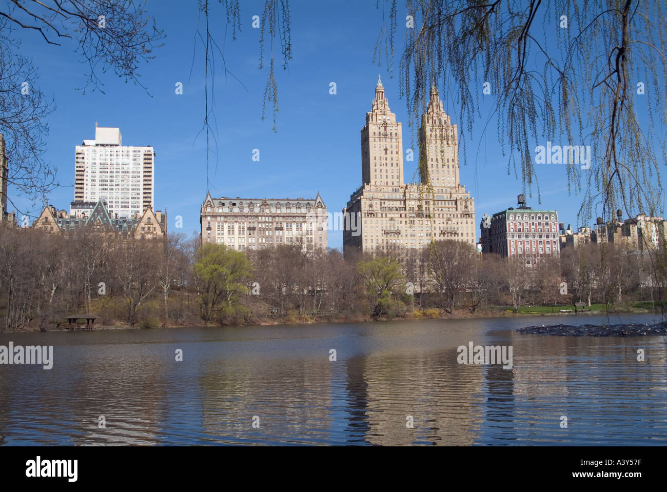 Central Park New York City lake and surrounding building architecture ...