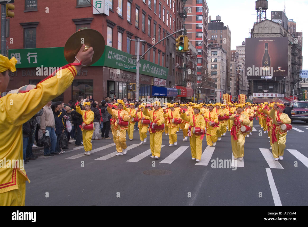 Chinatown New York City parade yellow costumes in rows on street Stock ...