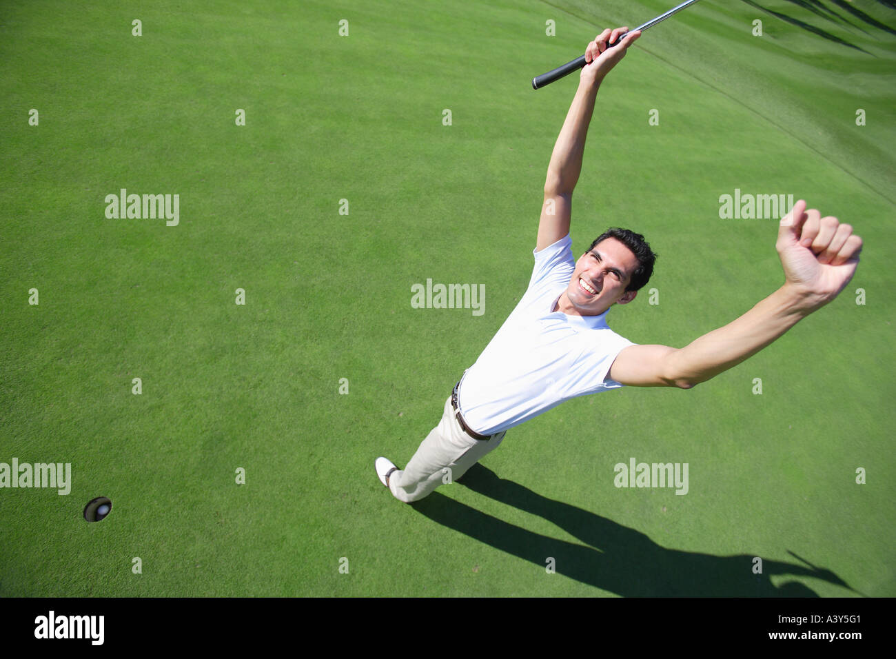 Male Golfer Celebrating A Successful Putt Stock Photo - Alamy