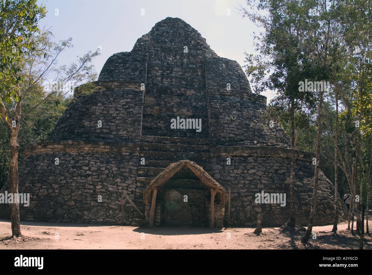 Wooden entrance leading to stone mayan ruins building Riviera Maya ...