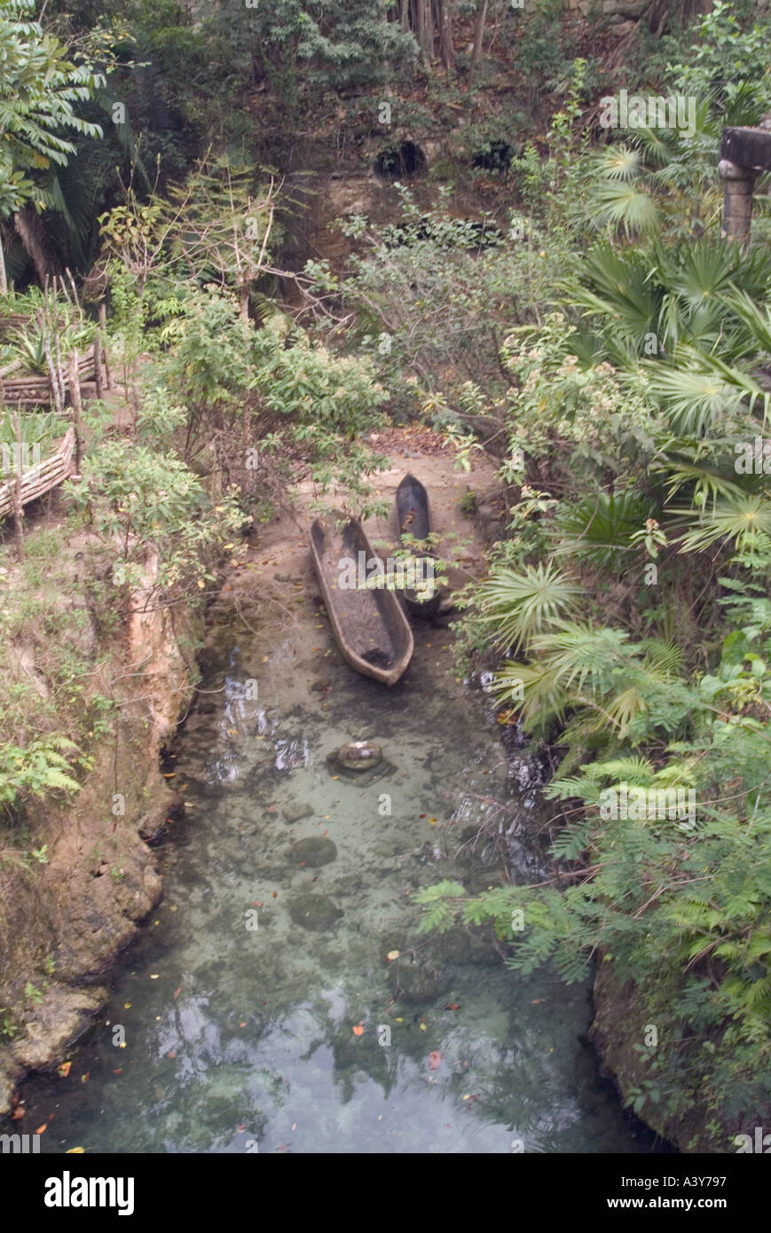 Mayan canoe parked at edge of river bed Xcaret Park Riviera Maya Mexico ...