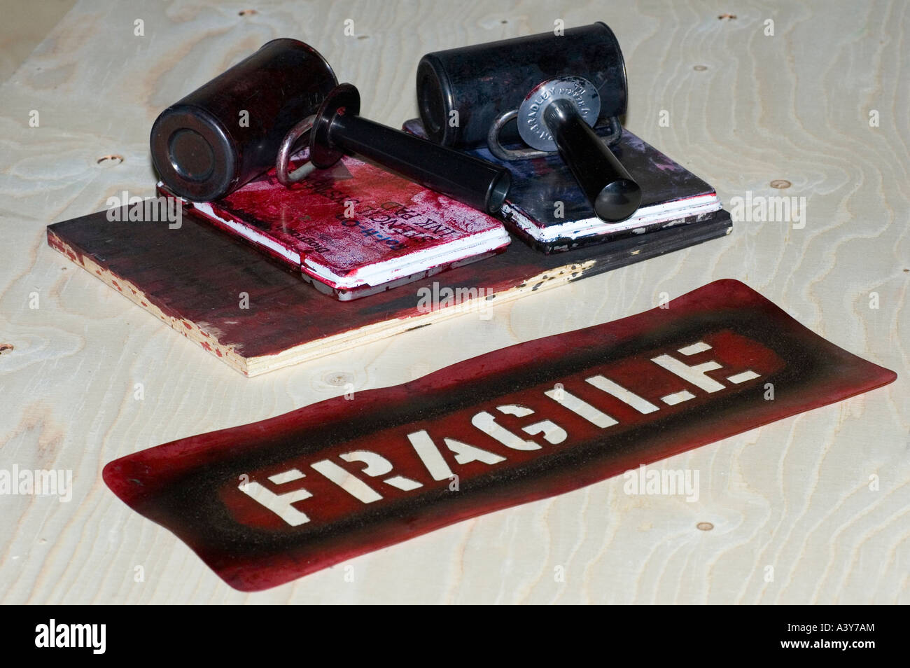 Rollers and templates for marking packing cases with the word FRAGILE ...