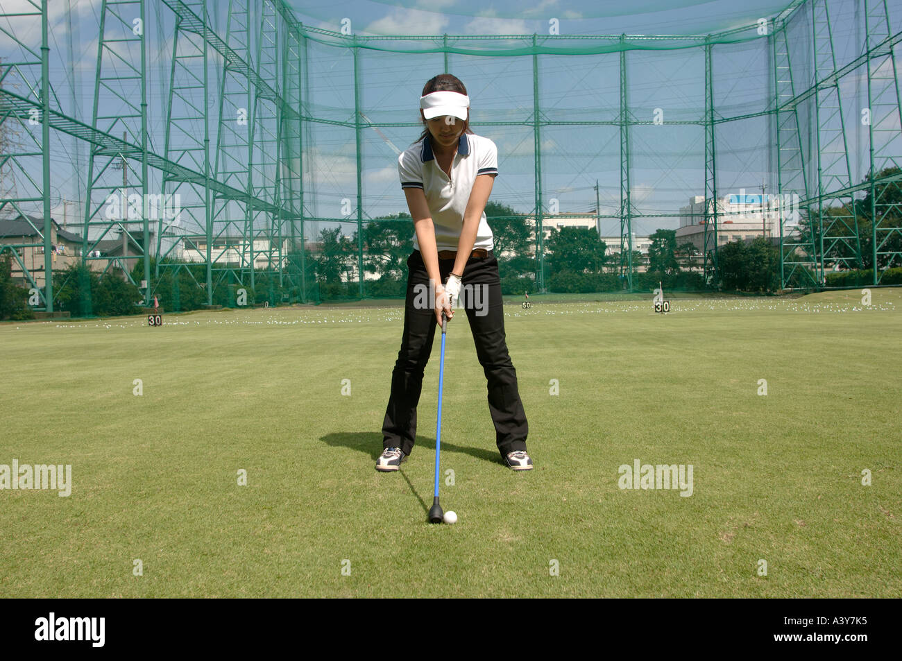Female golfer driving range hi-res stock photography and images - Alamy